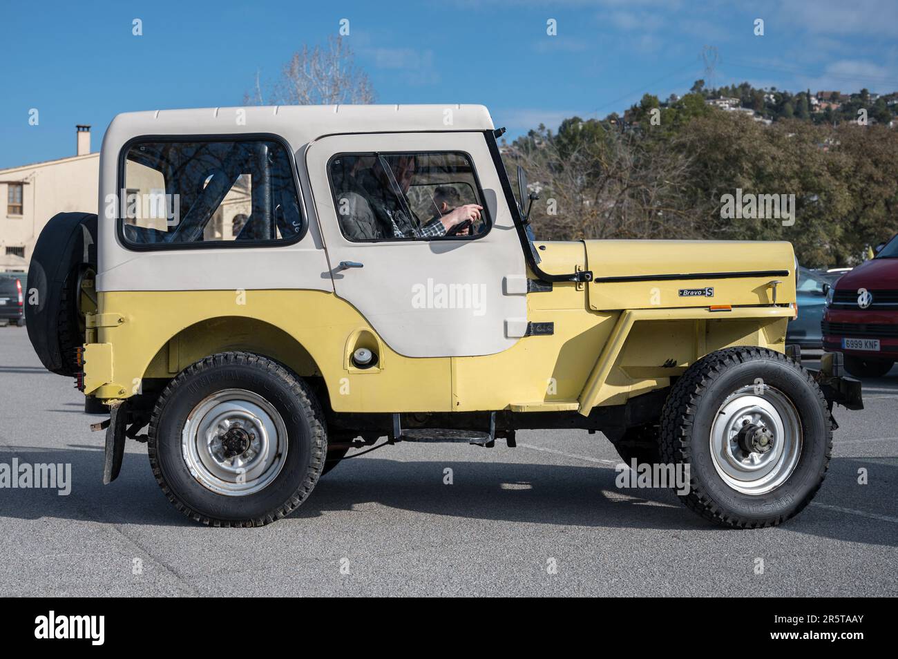 Side view of a classic off-road Jeep Ebro CJ-3B-E Bravo S in yellow ...