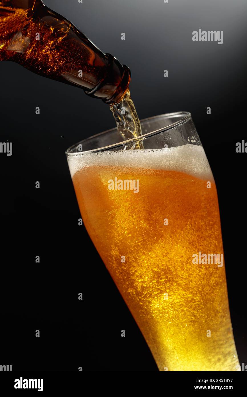 Pour beer from bottle glass hi-res stock photography and images - Alamy