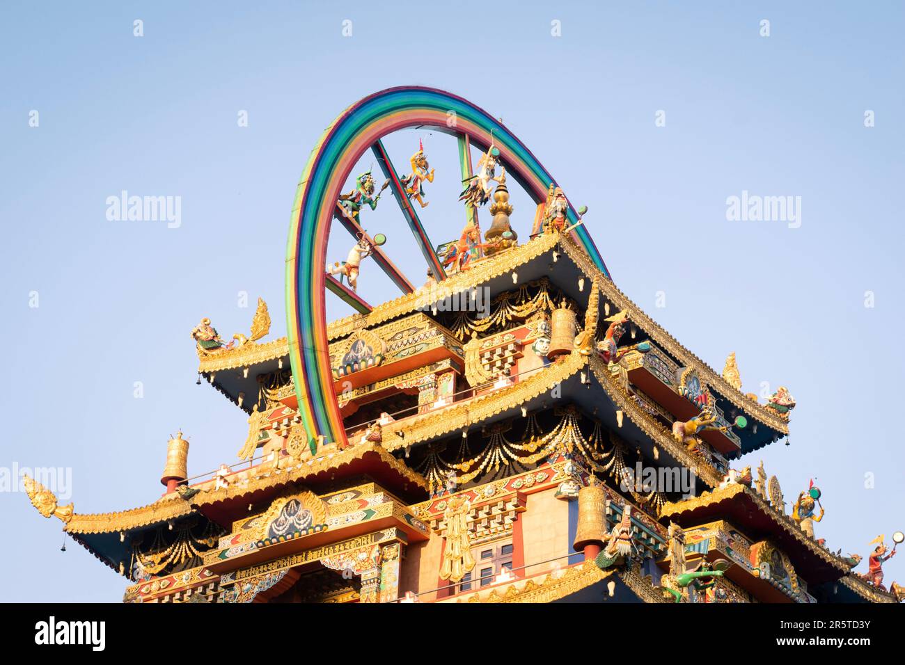 A modern high-rise building with two large sculptures adorning the ...