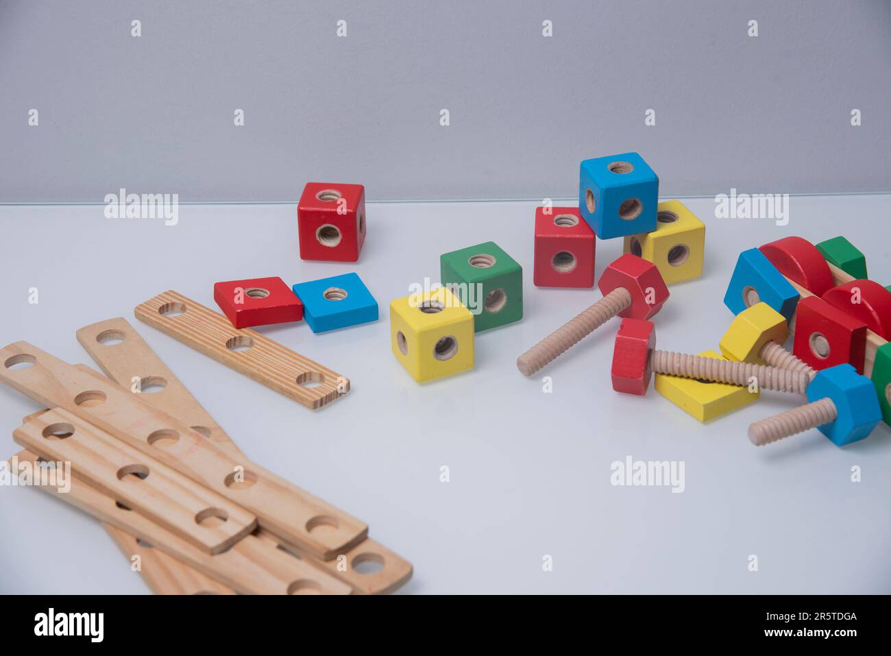 Wooden parts for the assembly of the designer. Child play with a toy ...