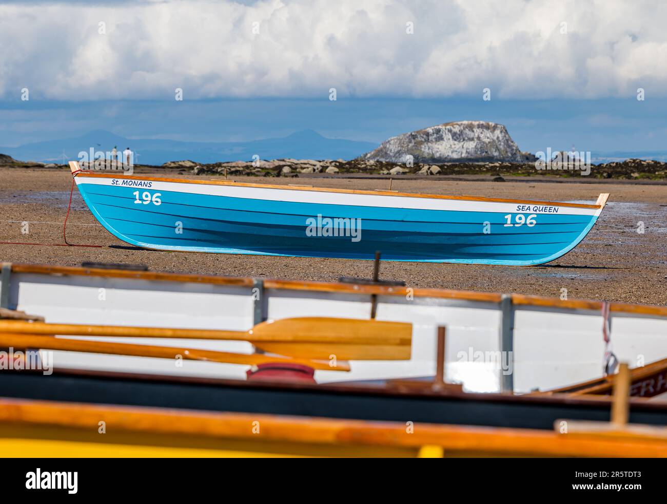 St Ayles' skiffs boats on beach in coastal rowing regatta, Firth of Forth, North Berwick, East ...
