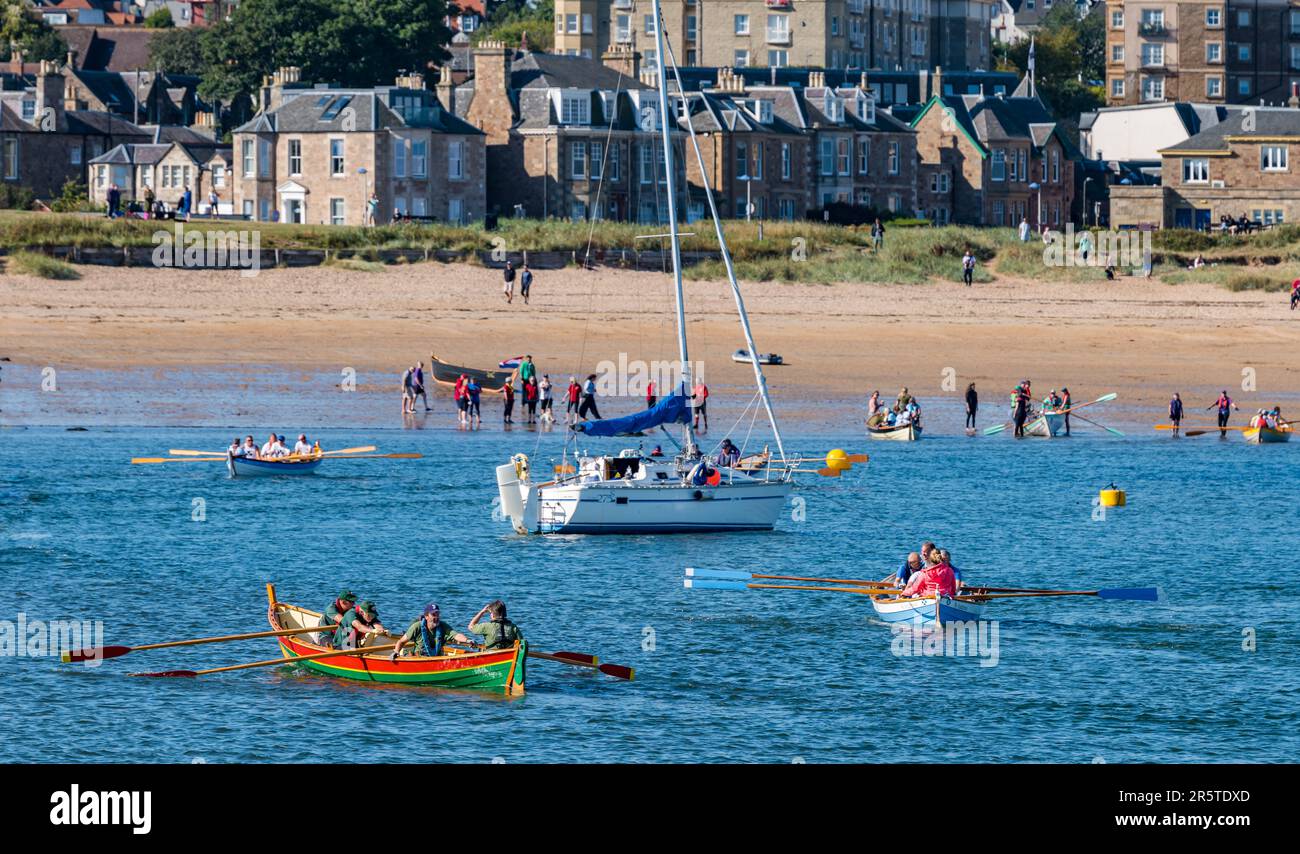 St Ayles' skiffs boats in coastal rowing regatta in sunny weather, Firth of Forth, North Berwick ...