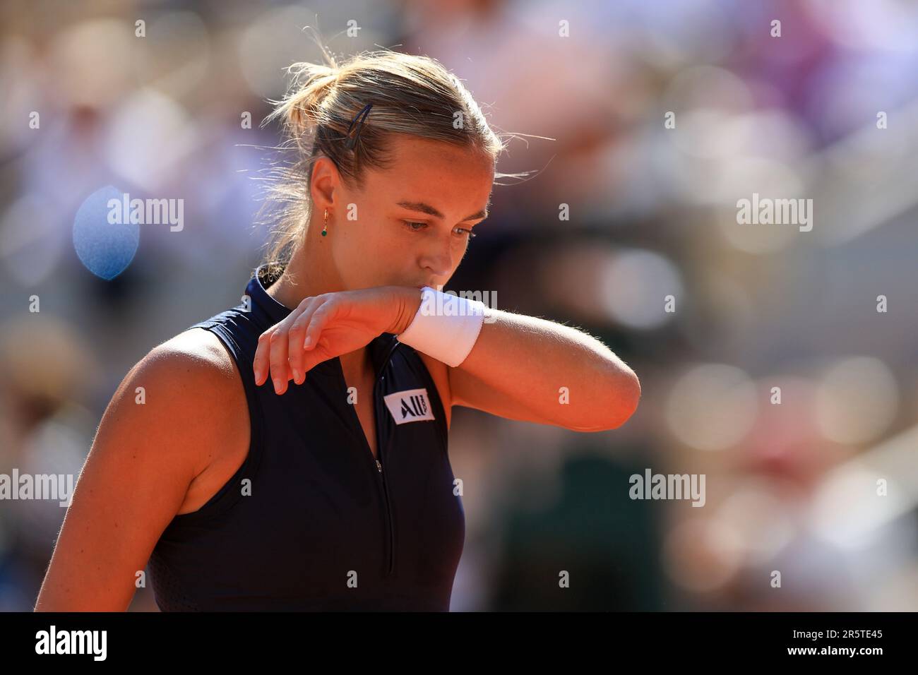 Slovakia's Anna Karolina Schmiedlova wipes the sweat off her face ...