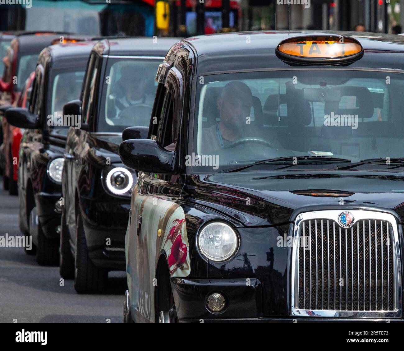 London, UK - April 30th 2023: A traffic queue of London Taxis, on ...