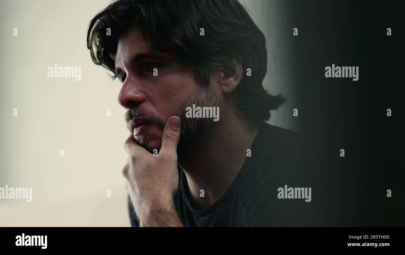 Worried young man mentally stuck in stress and anxiety. Preoccupied ...