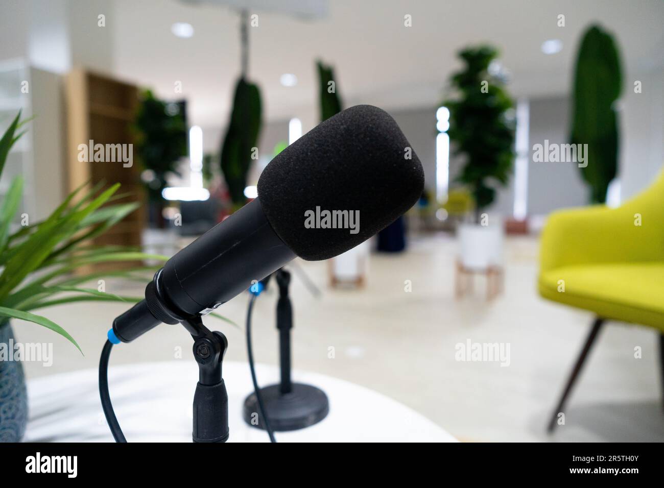 The podcast audio microphone is black. Microphone on the table Stock ...