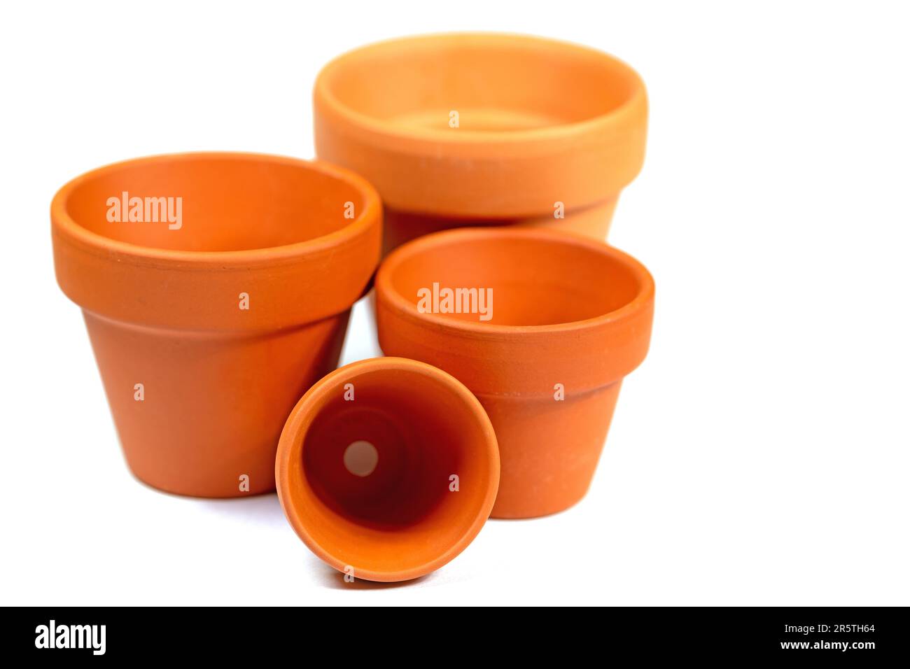 Empty flower pots isolated against white background Stock Photo - Alamy