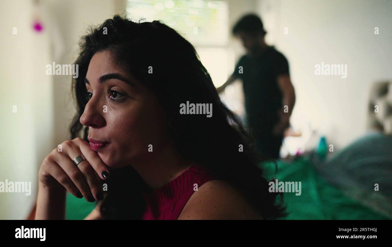 Wife Cynically Rolls Eyes as Husband Yells and Gestures in Background ...