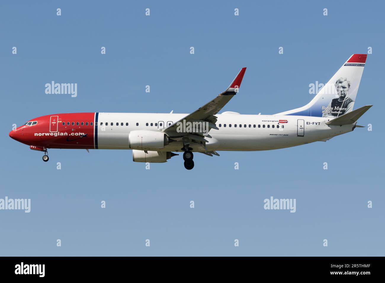 Close-up view of an Air Canada airplane in flight against a backdrop of ...