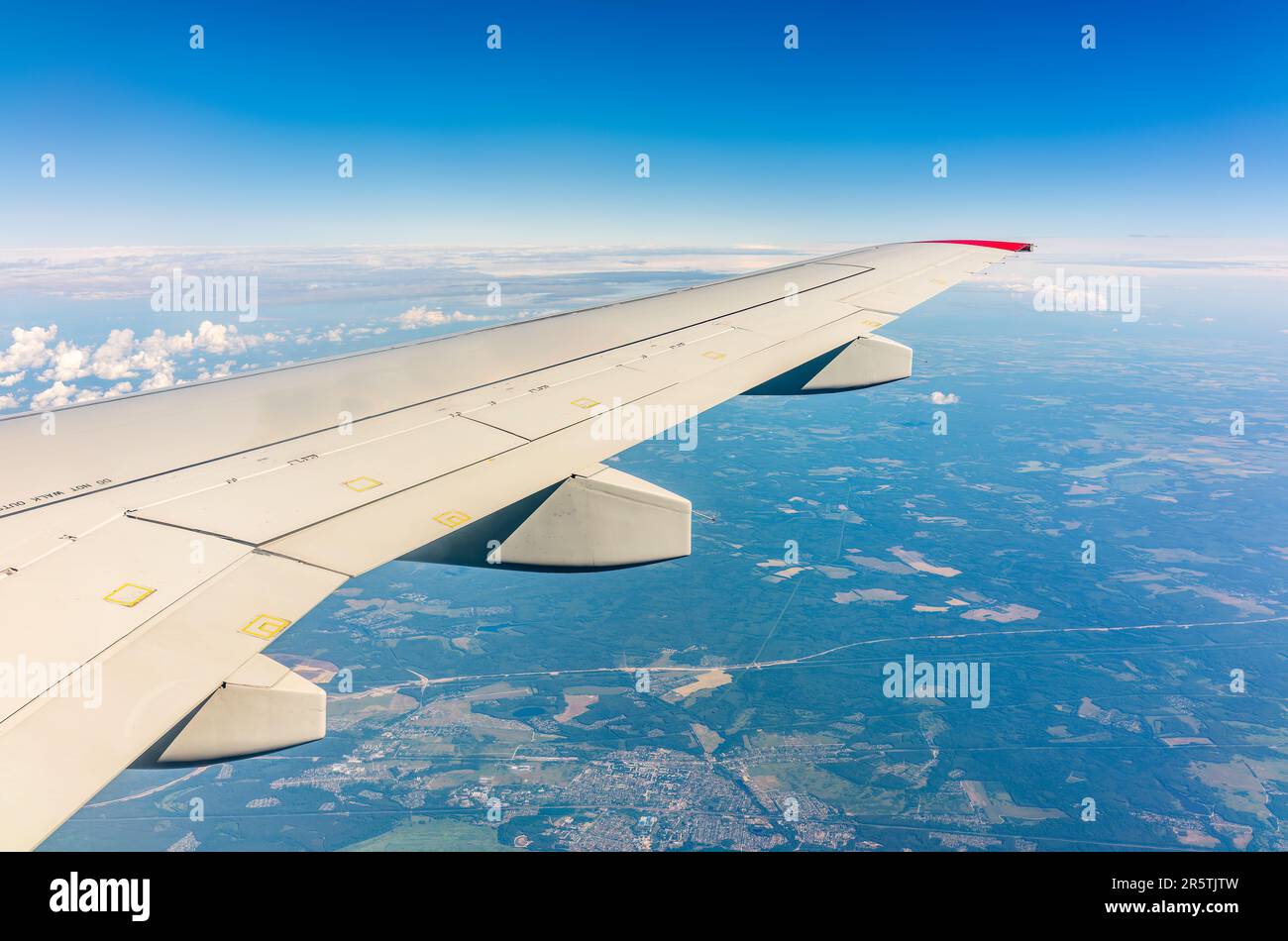 View from the airplane window at a beautiful cloudy sky and the ...