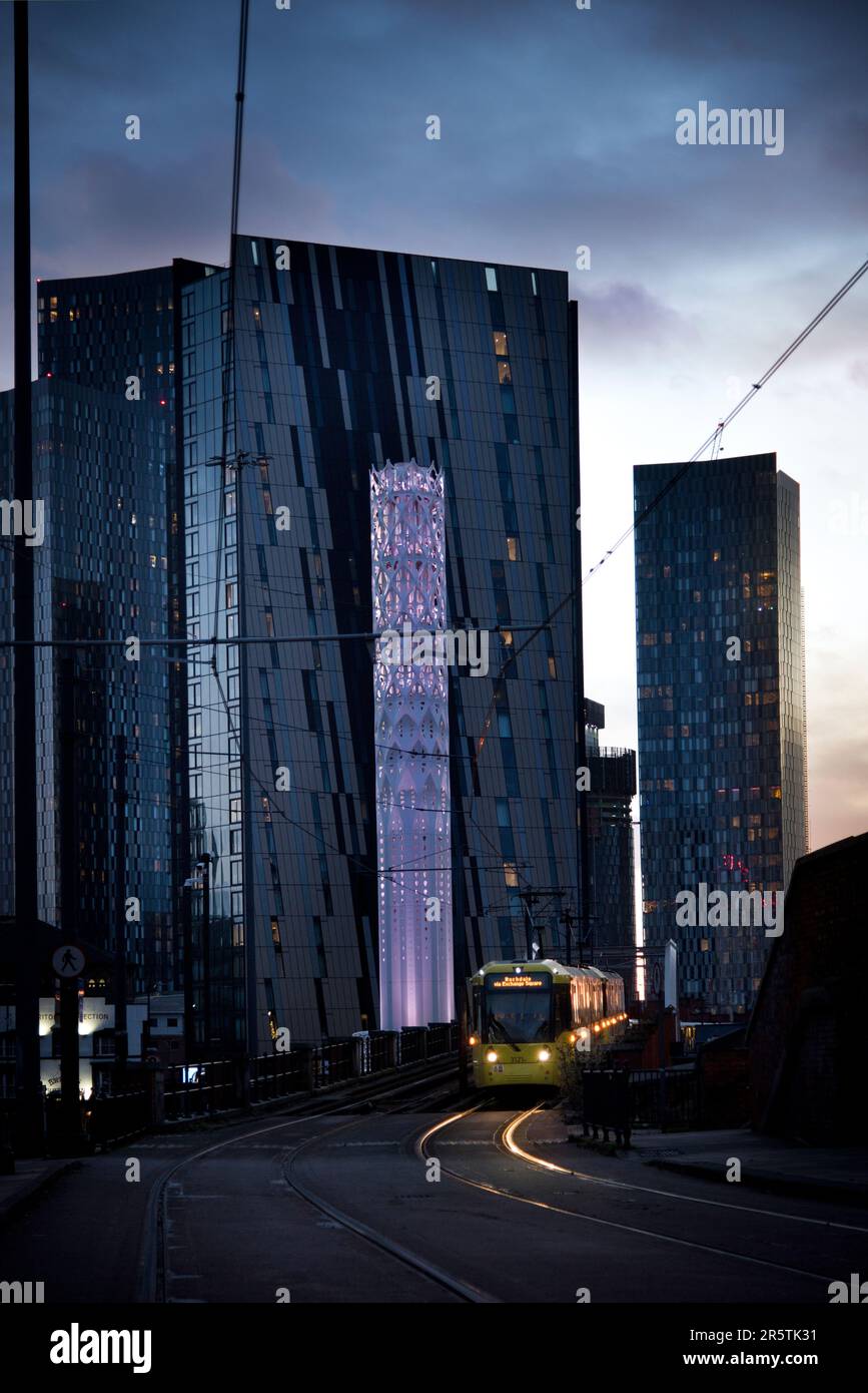 Sunset scene of Manchester Skyline, featuring a tram Stock Photo - Alamy
