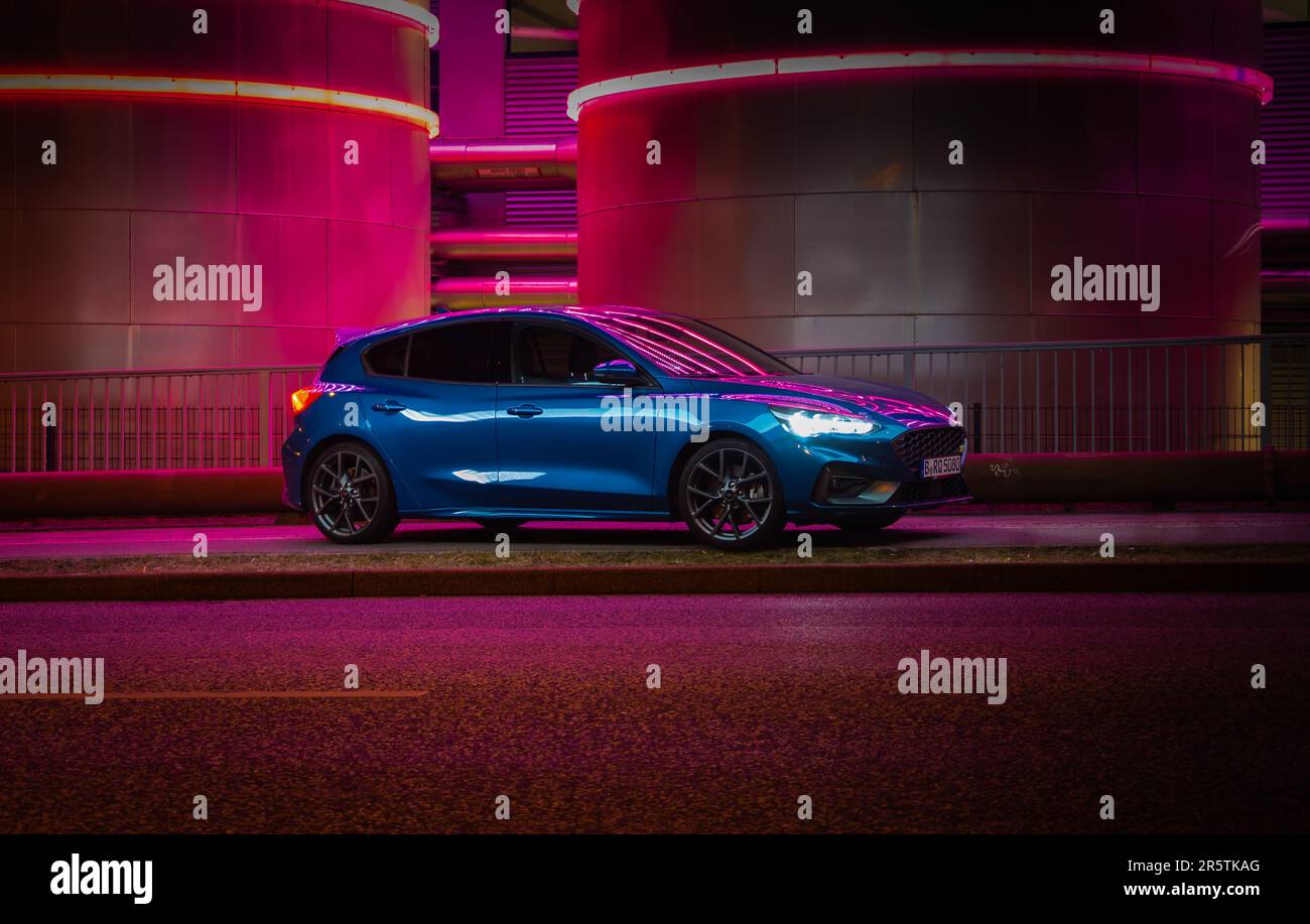 2020 Ford Focus ST parked in an urban setting at night, illuminated by ...