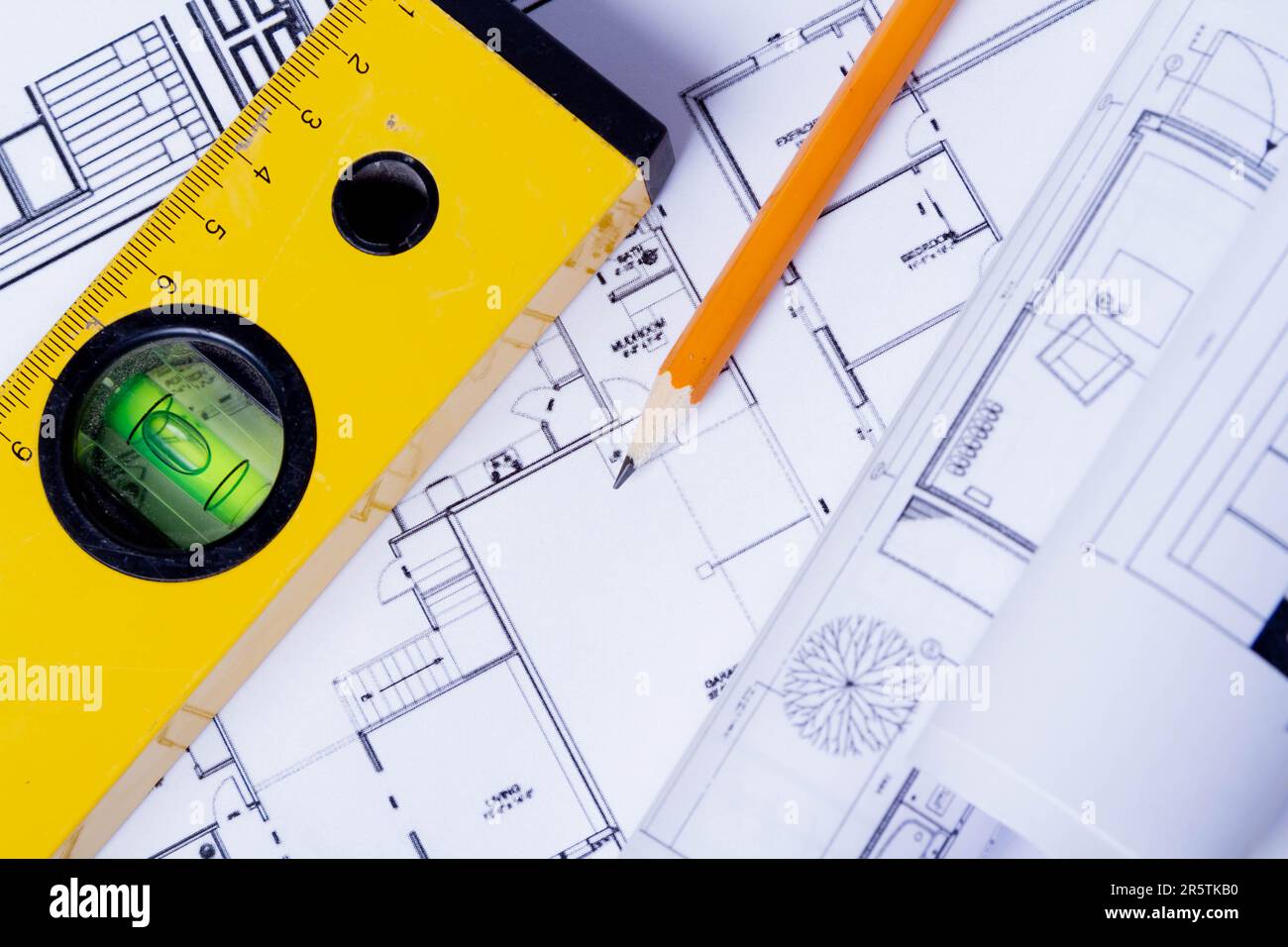 Builder's tools on the scheme of the house. Preparing to build a house ...
