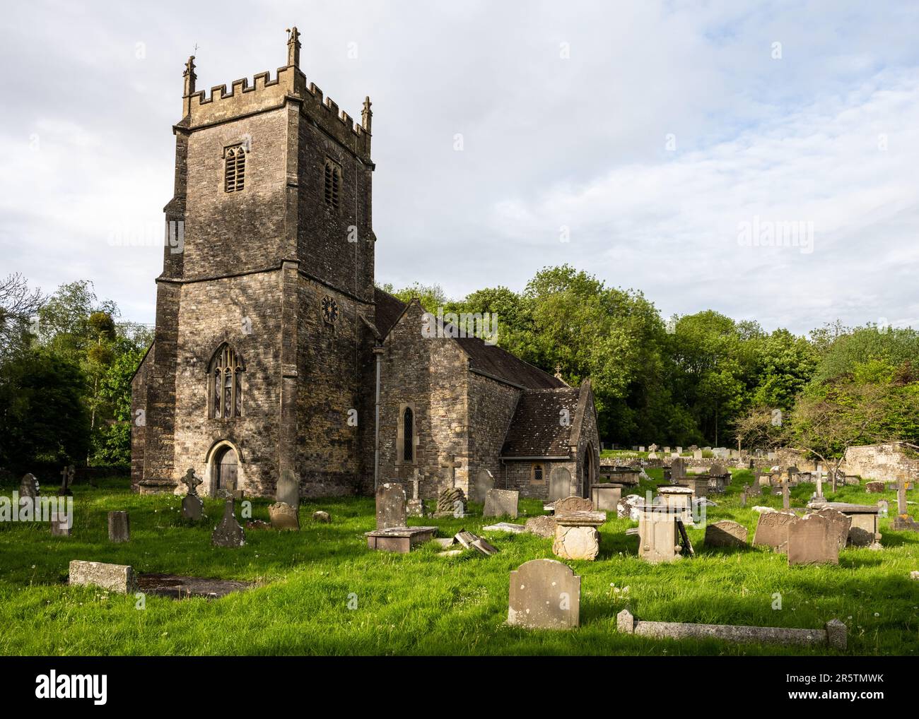 Sun shines on the traditional parish church of St James in Tytherington ...