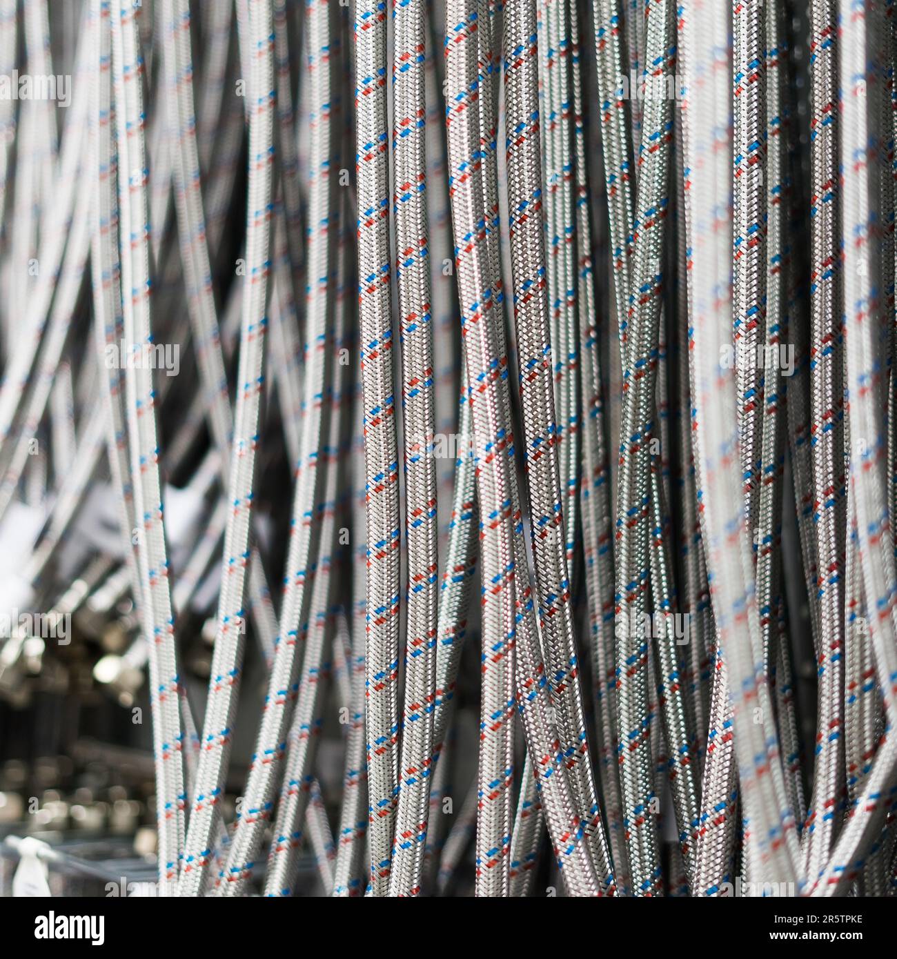 Closed up braided stainless steel texture of flexible hose arranged in ...