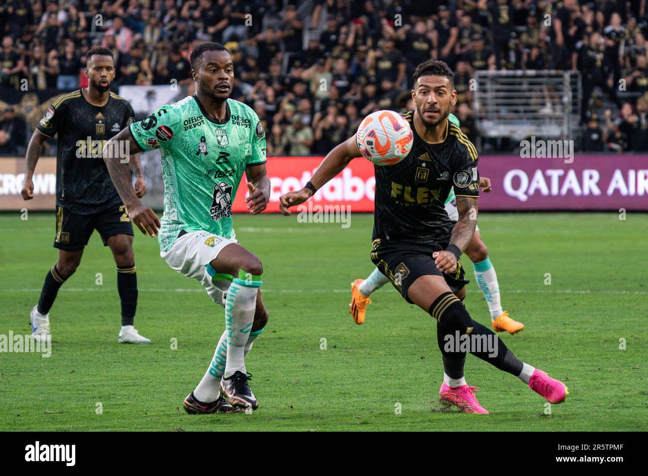LAFC forward Denis Bouanga (99) and Club León forward Joel Campbell (12) fight for possession ...