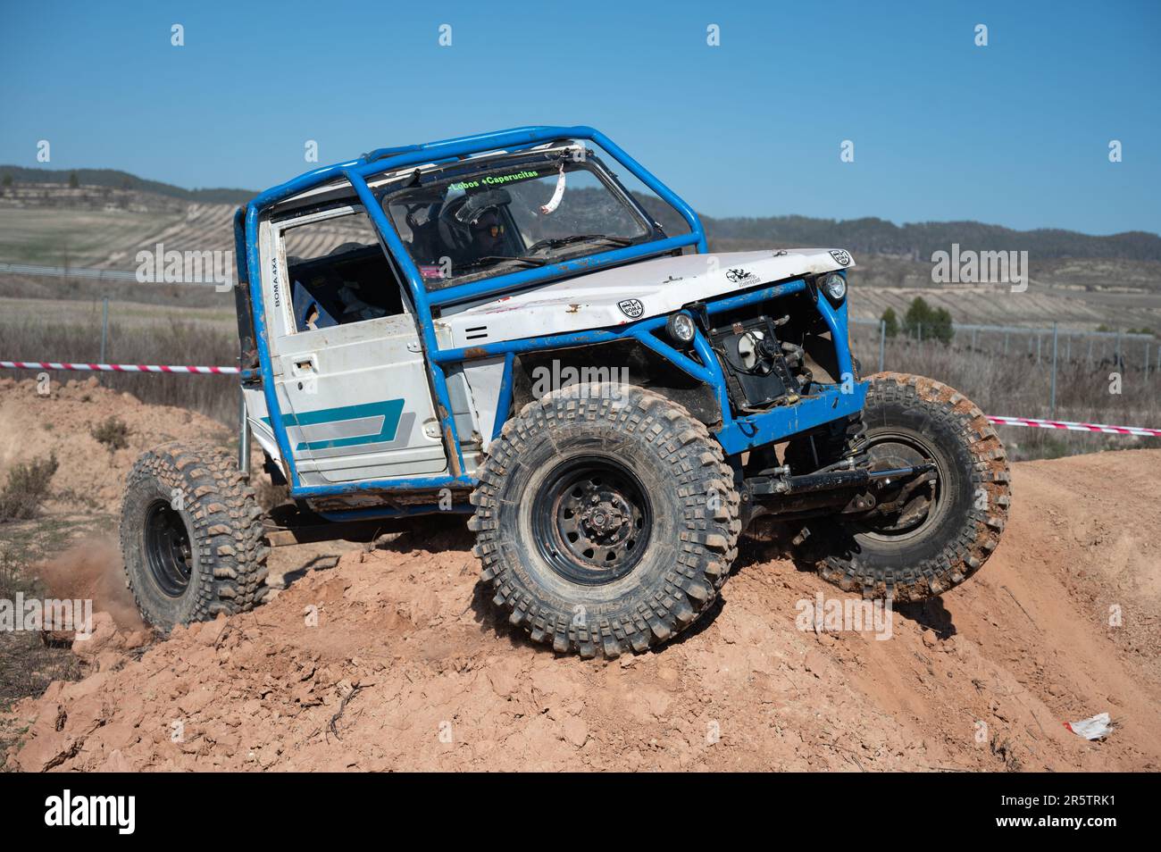 A white Suzuki Samurai with anti-roll bars modified for crawling Stock ...