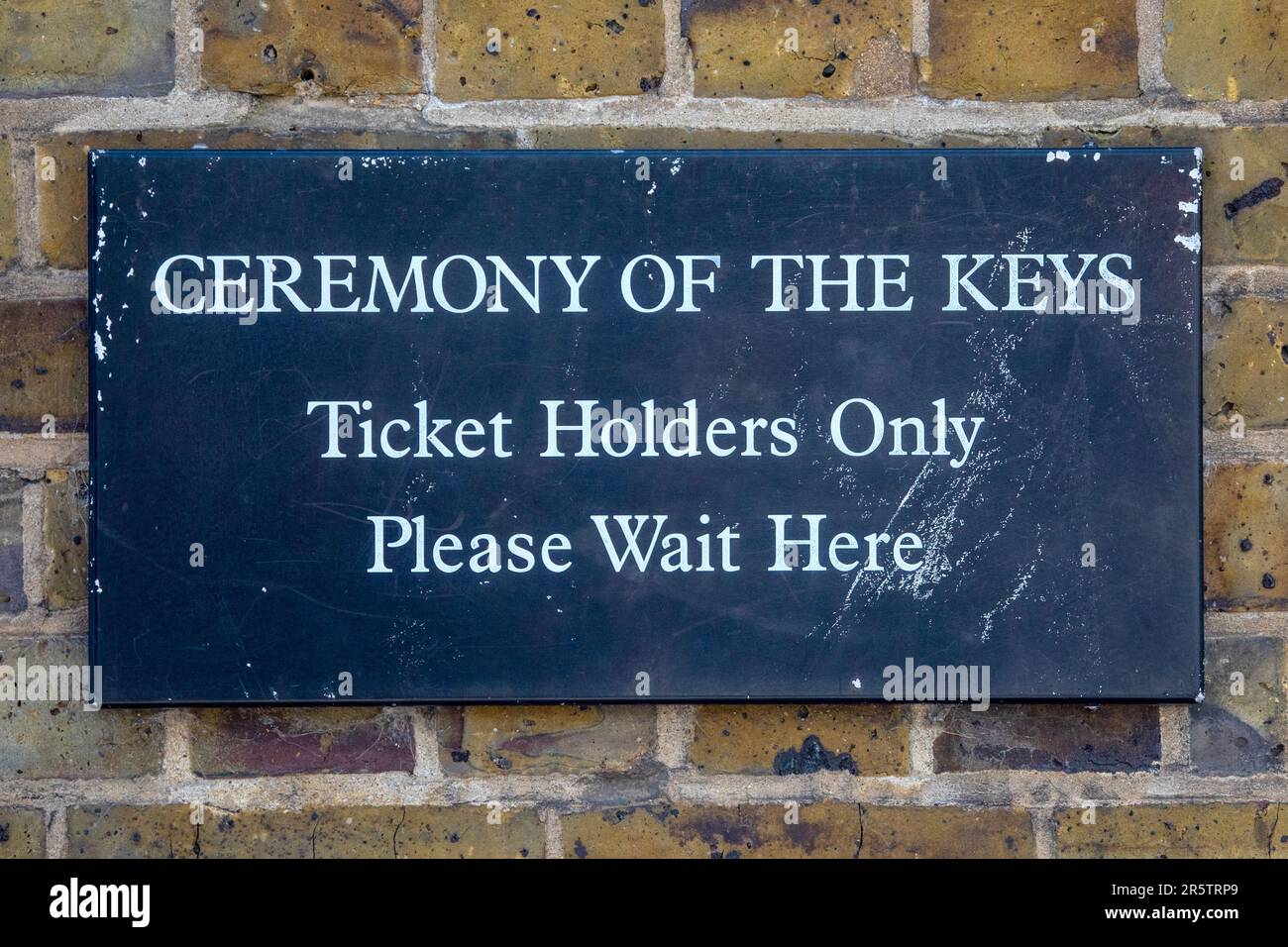 A sign showing visitors where to queue for the Ceremony of the Keys at ...