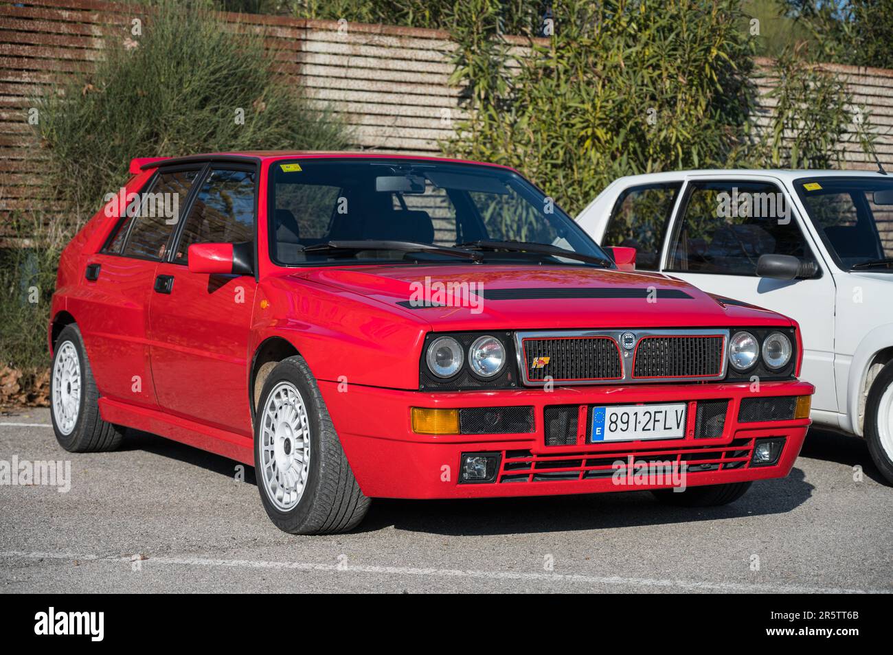 A red-colored Lancia Delta HF parked on the street Stock Photo - Alamy