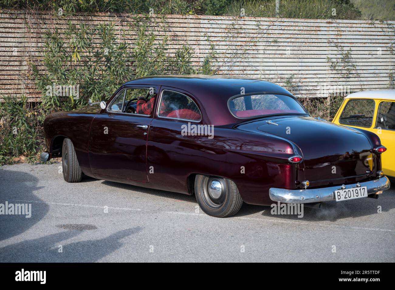 The rear view of the purple '49 bullet nose Ford on the street Stock ...