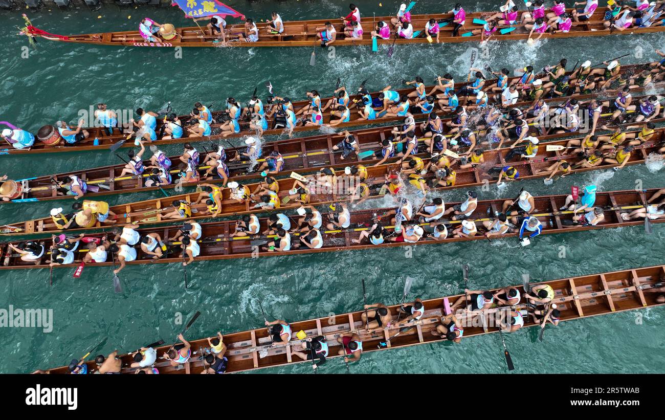 An aerial view of multiple university teams rowing boats in the ...