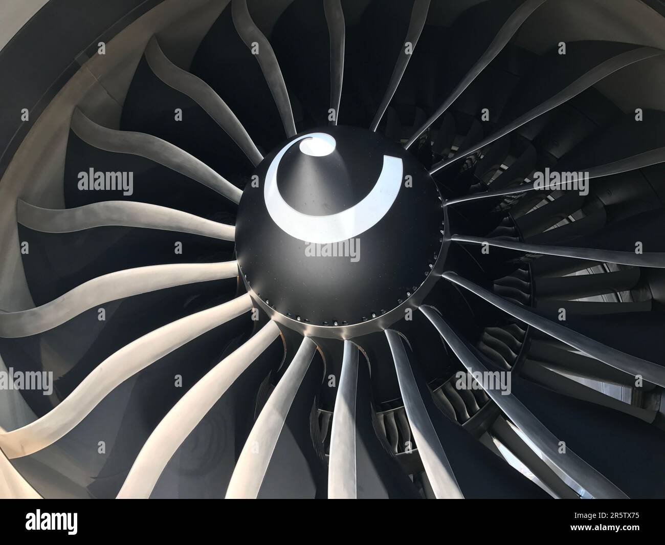 A commercial airplane engine with large turbine blades and wheels Stock ...