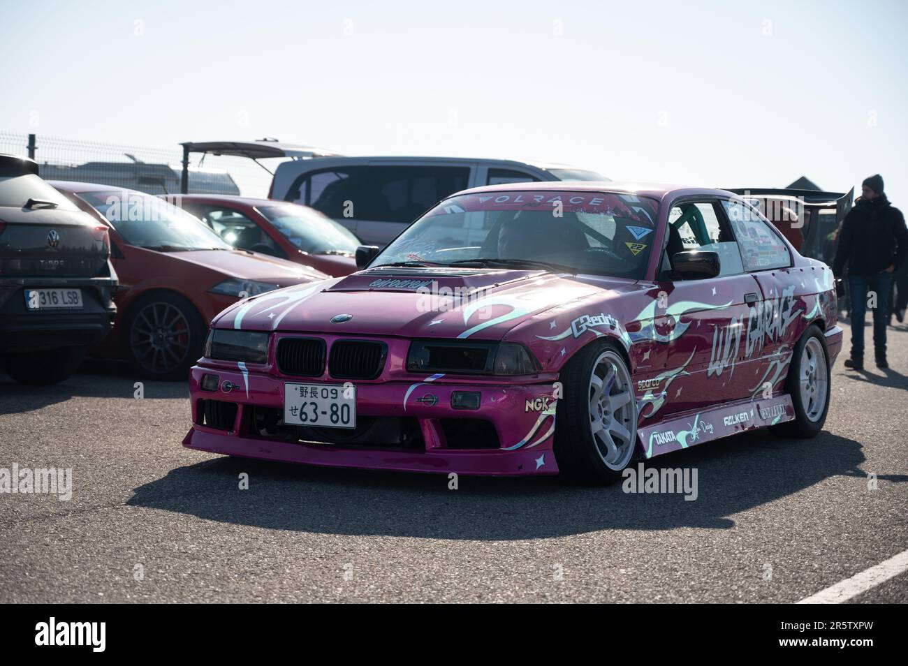 Detail of a beautiful pink BMW E36 with sponsor stickers, it is a ...