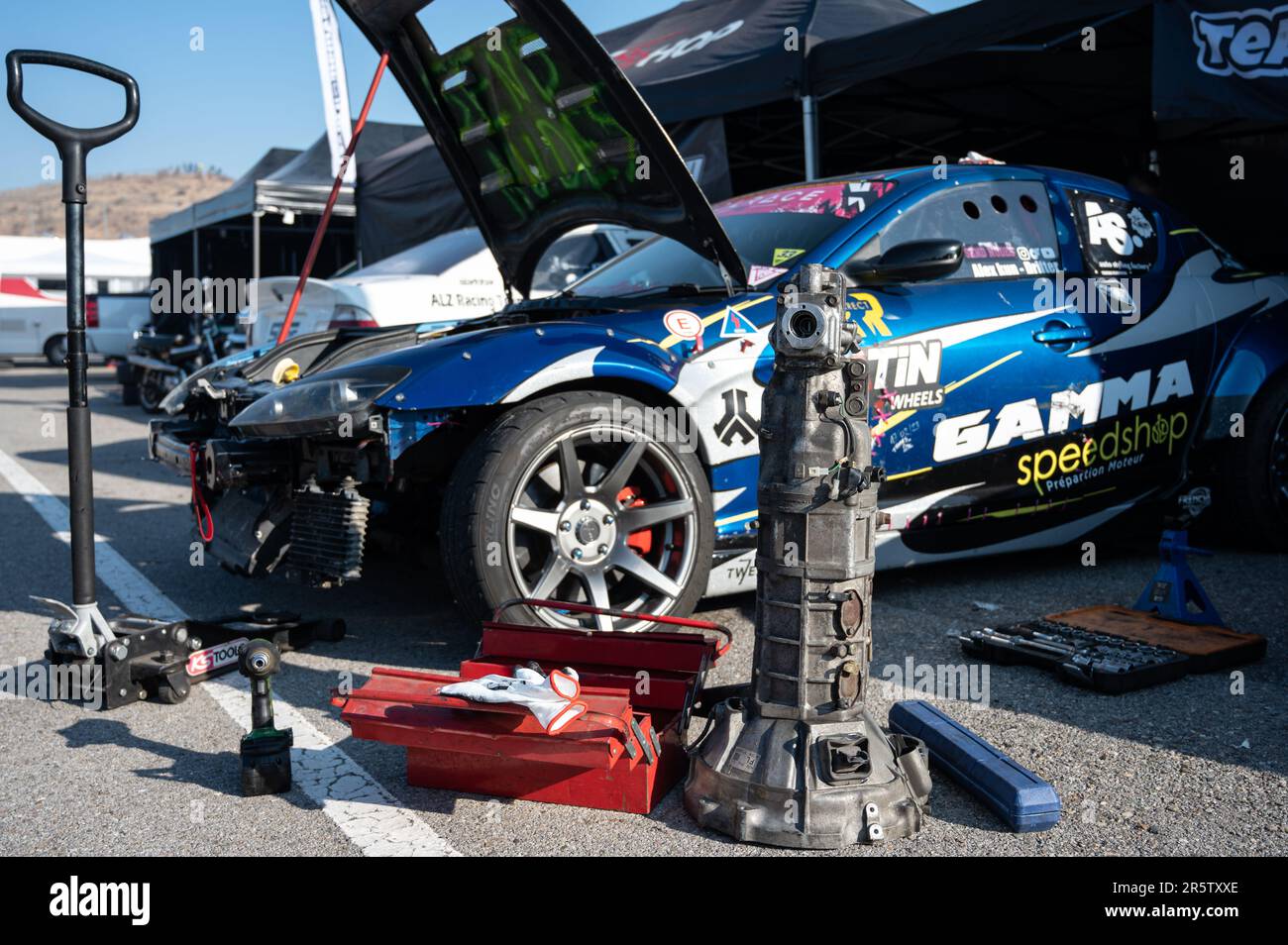 Detail of a manual gearbox and a toolbox on the ground, repairing the ...