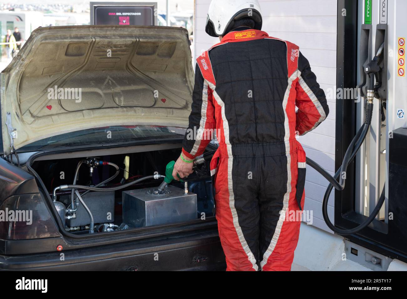 Detail of a racing driver refueling gasoline at the circuit's gas ...