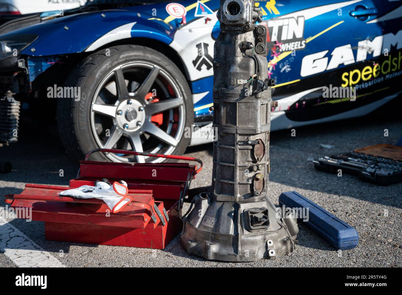 Detail of a manual gearbox and a toolbox on the ground, repairing the ...