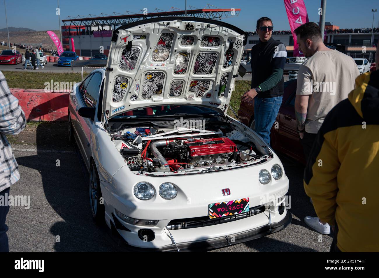 Detail of a third generation white Honda Integra with the hood open ...