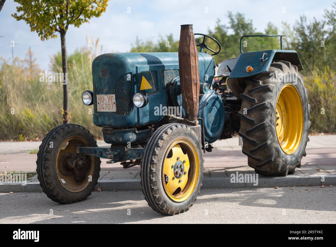 Front view of a nice classic tractor, it is a green tractor with yellow ...
