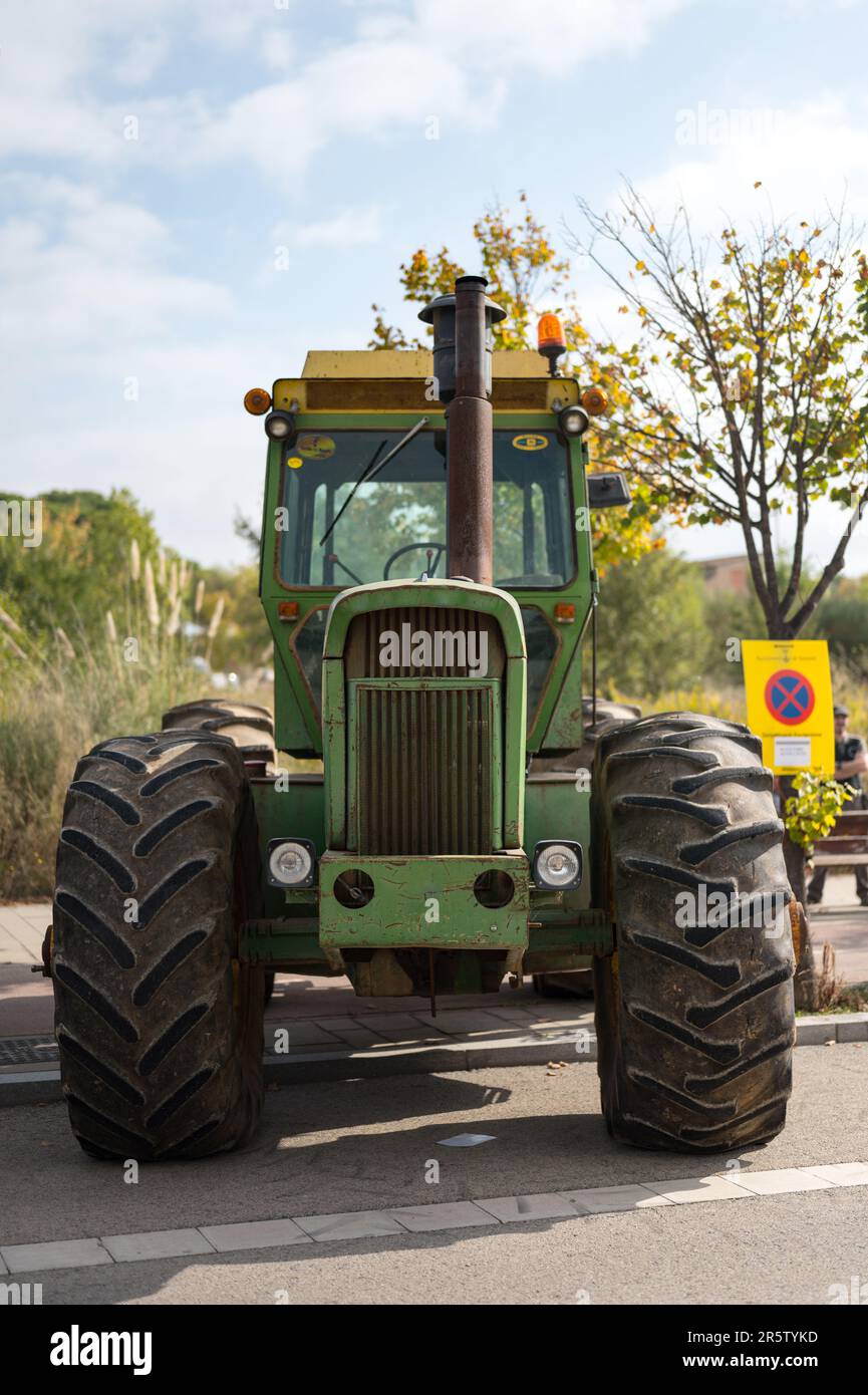 large articulated green tractor parked Stock Photo - Alamy
