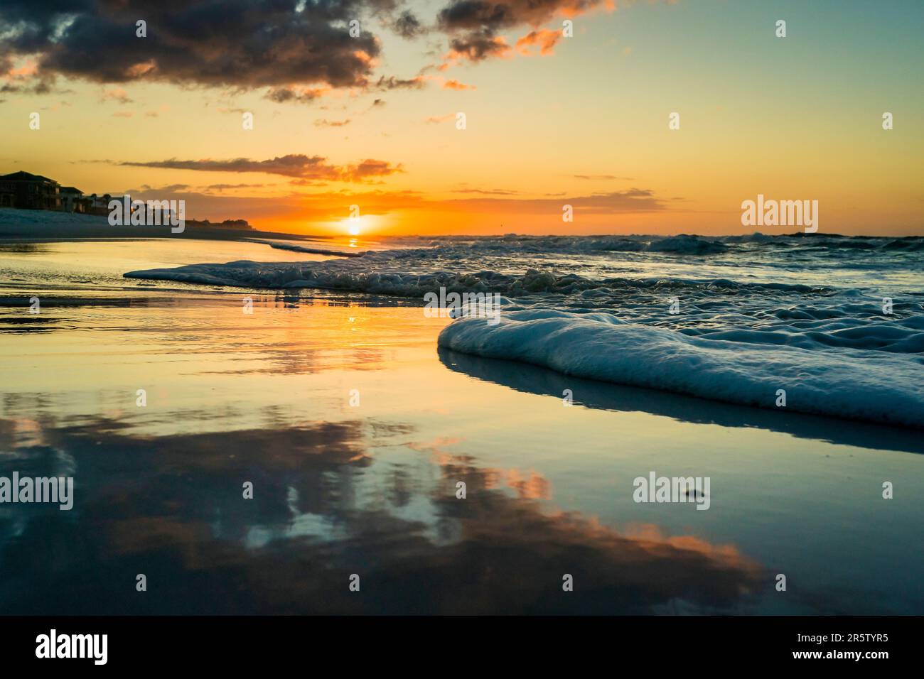 An idyllic beach setting with an untouched stretch of sand leading down ...