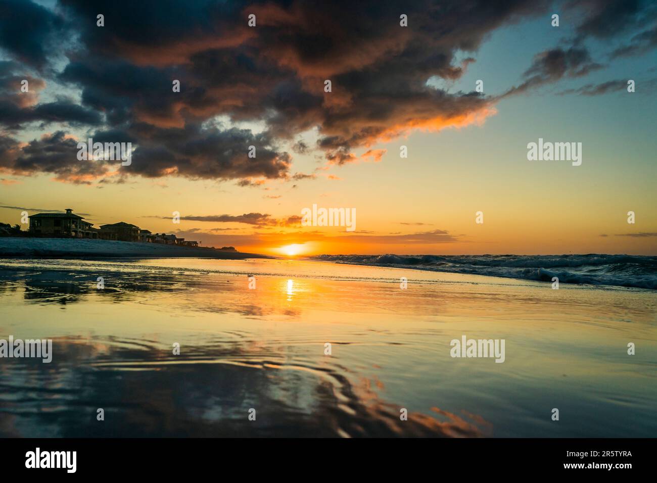 A scenic beach scene featuring an illuminated kite soaring against a ...