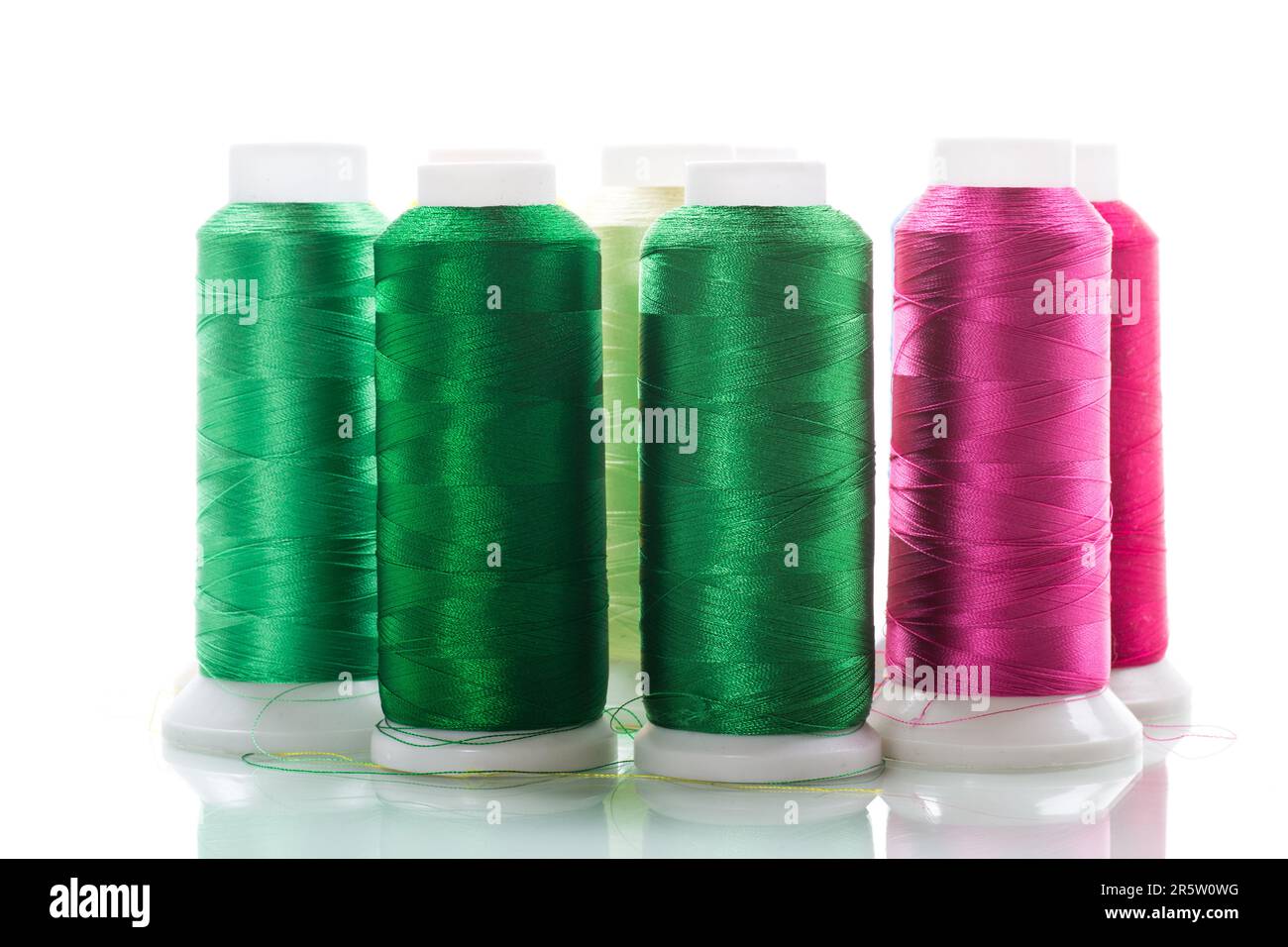 set of different color sewing threads, isolated on white background ...