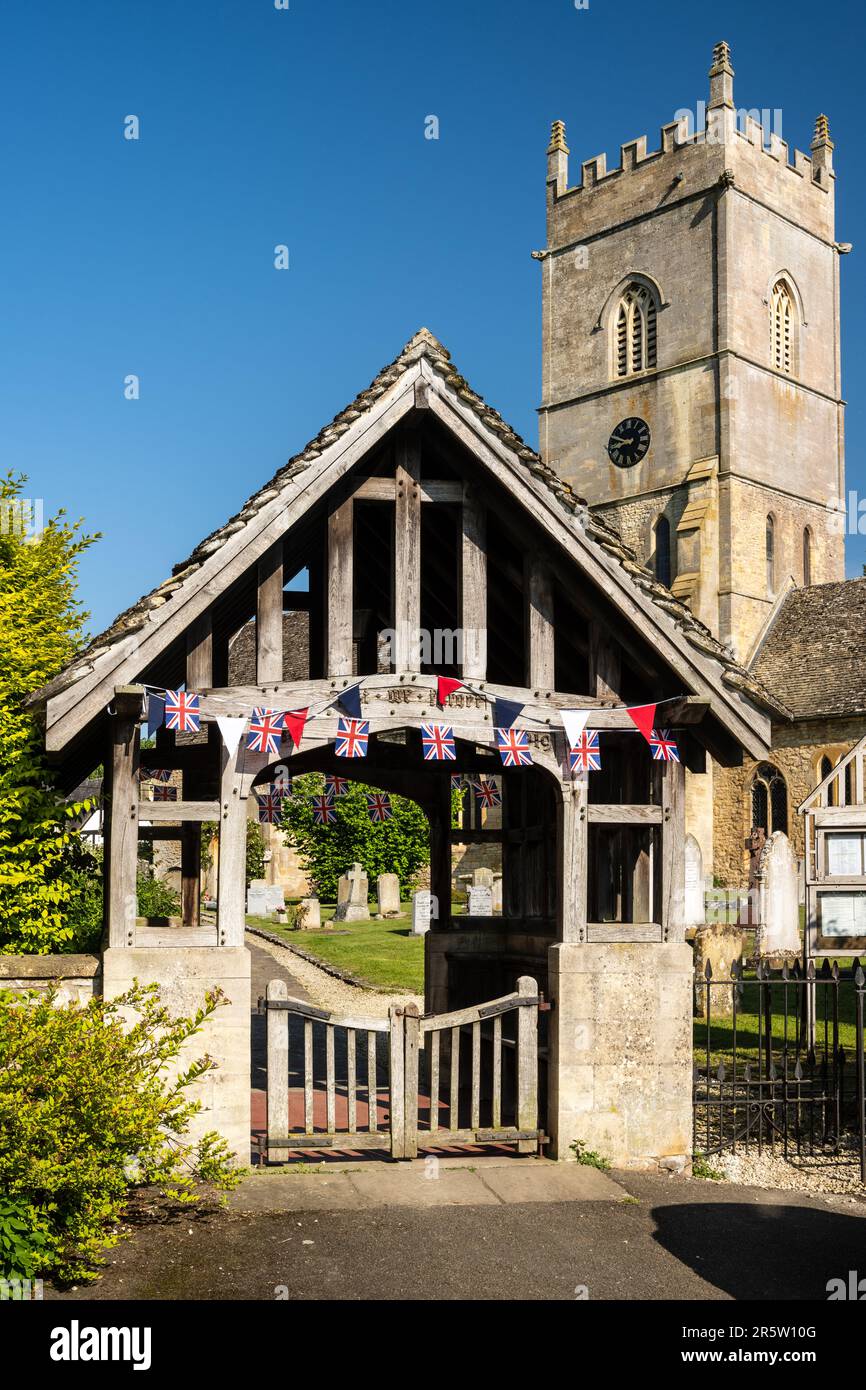 Shin shines on the tower and lych gate of the traditional parish church ...