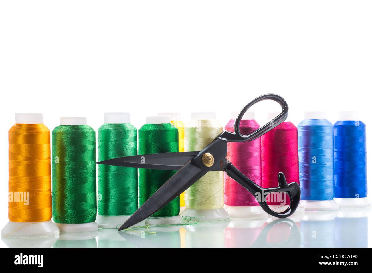 set of different color sewing threads, isolated on white background ...