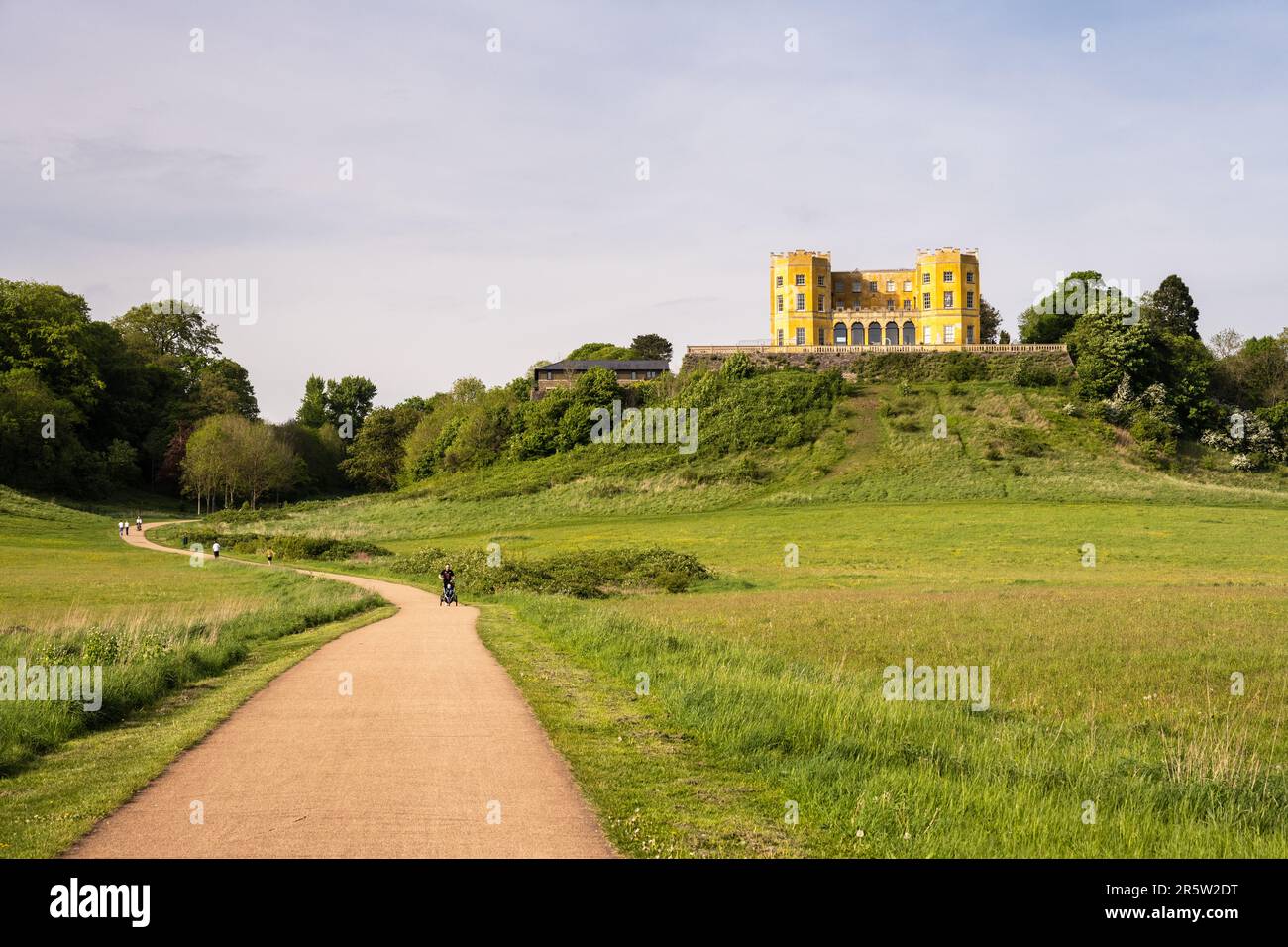 People walk and jog on the Frome Greenway path through Stoke Park in ...