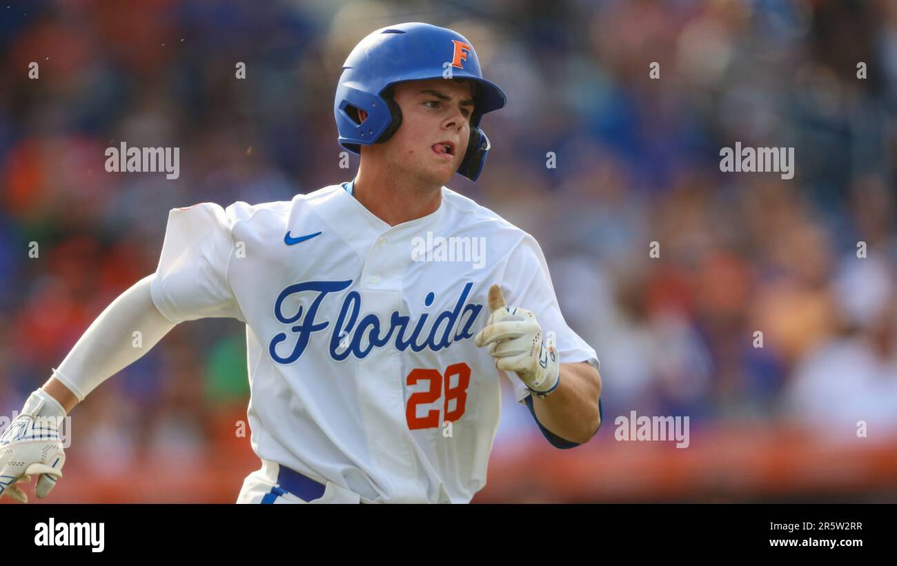 Florida catcher Luke Heyman (28) runs to first base during an NCAA ...