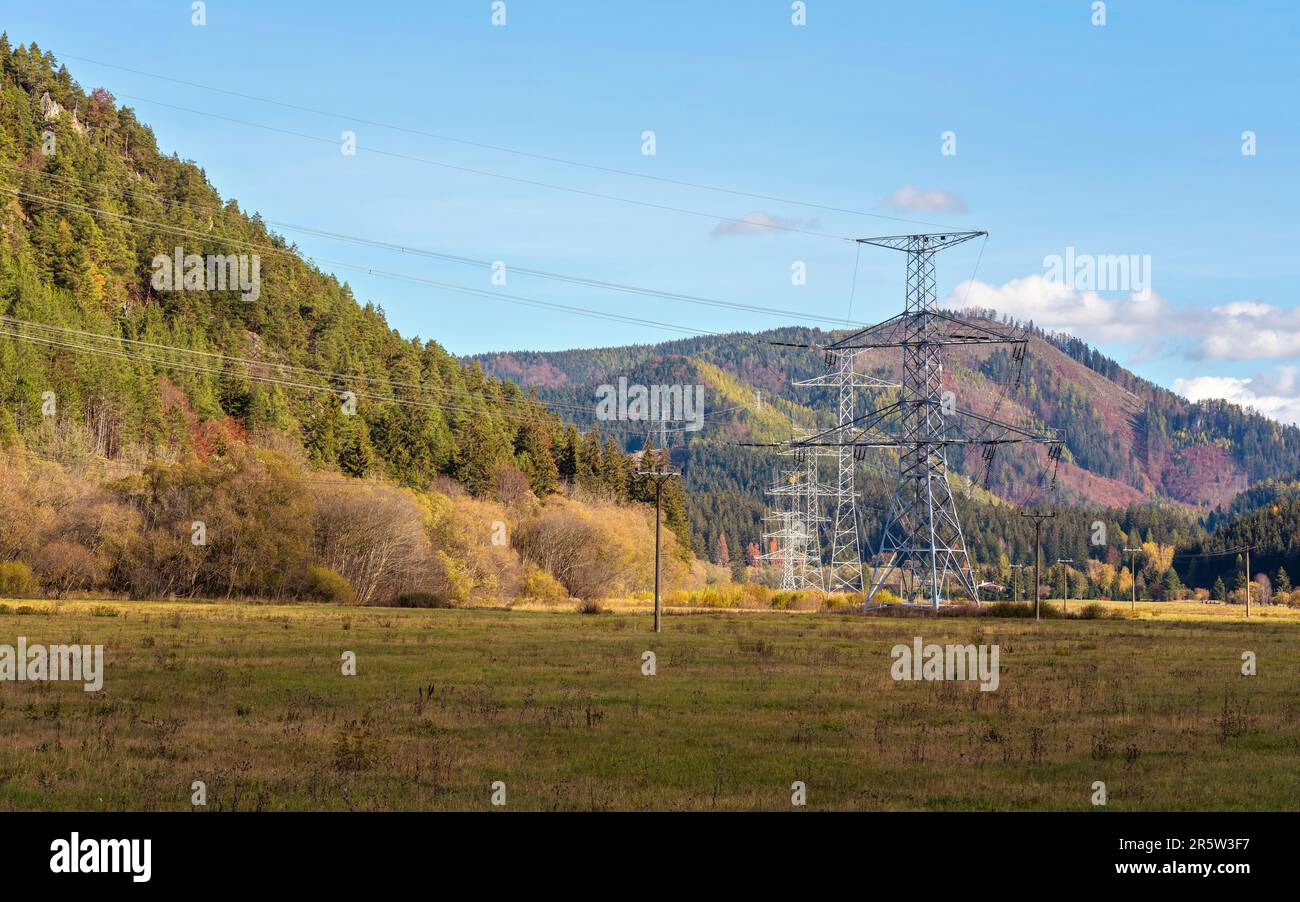 Large metal power pylon under electricity lines built in countryside ...