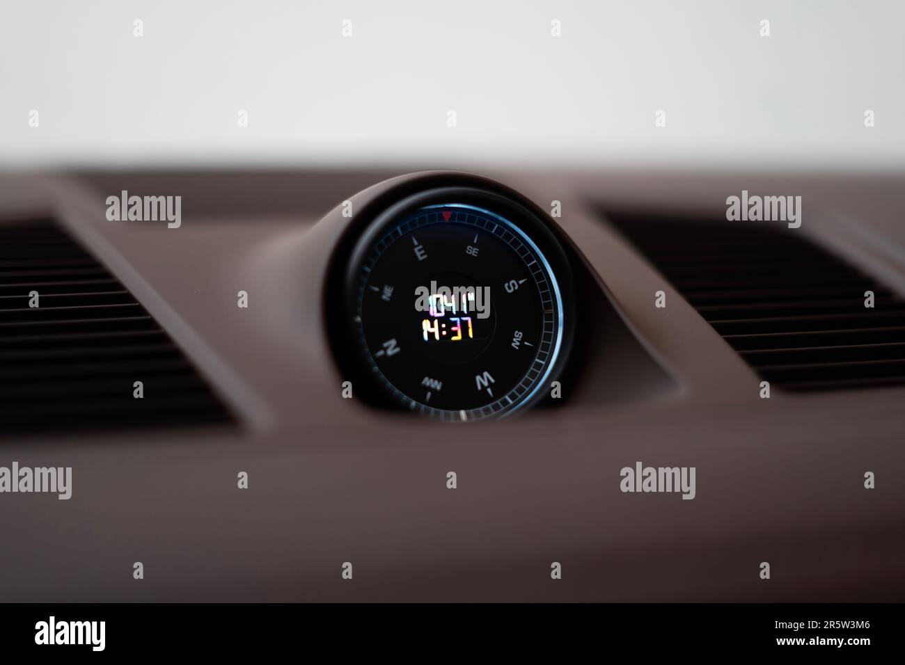An interior view of a car, featuring a clock on the dashboard Stock ...