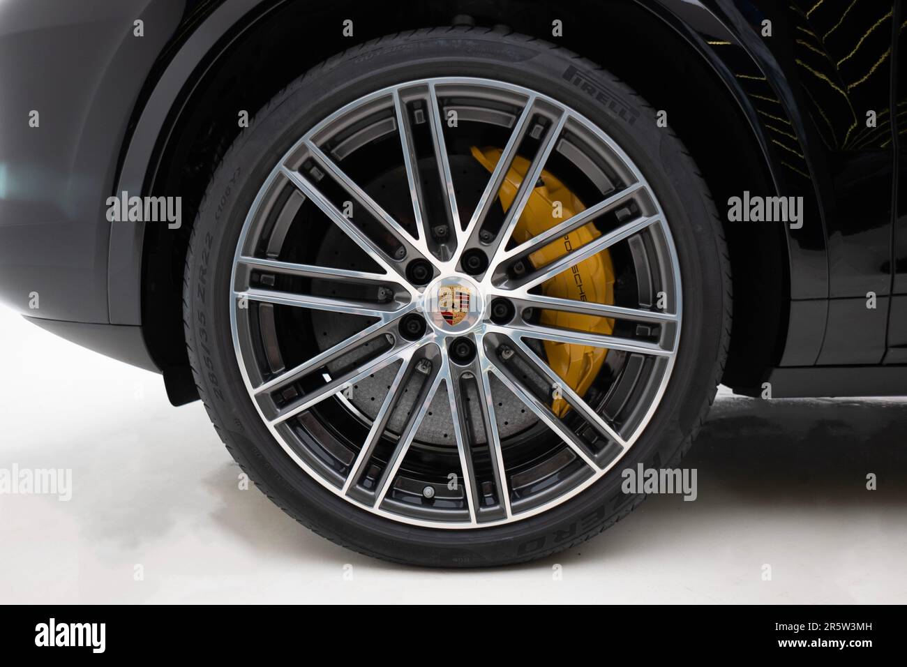 A silver rimmed tire of a parked car on a white background Stock Photo ...