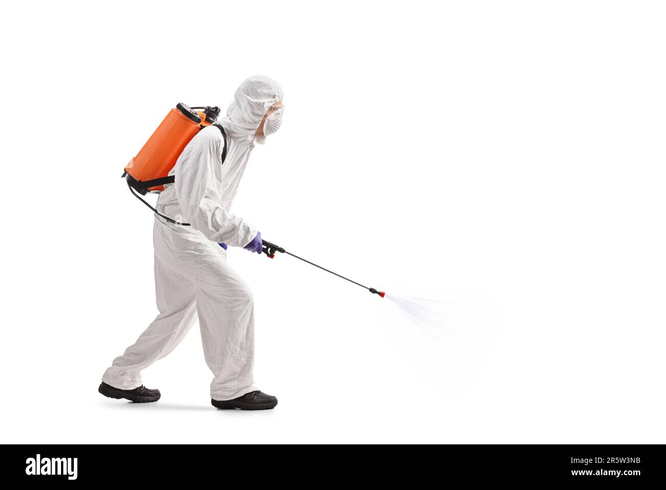 Full length profile shot of a man in a hazmat suit applying pesticide ...
