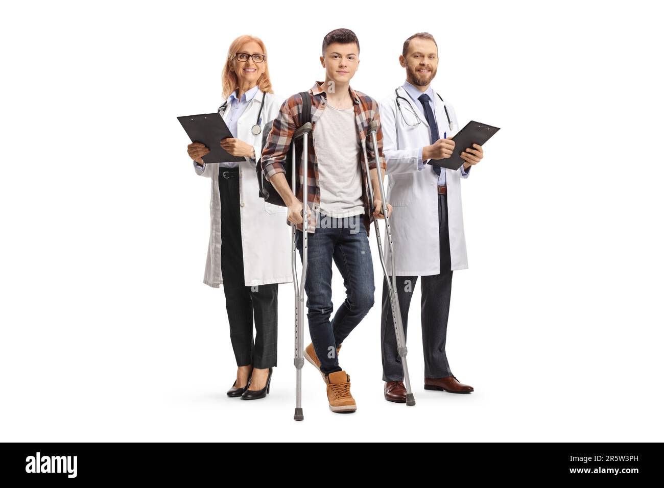 Team of doctors behind a male student with crutches isolated on white ...