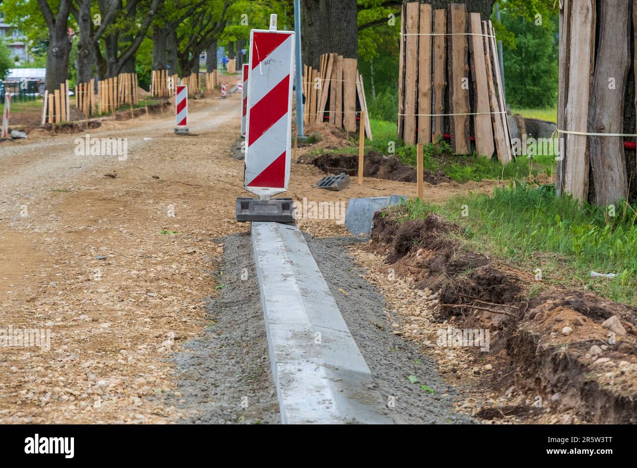 Tree trunk protection. A tree trunk covered with boards to protect from ...