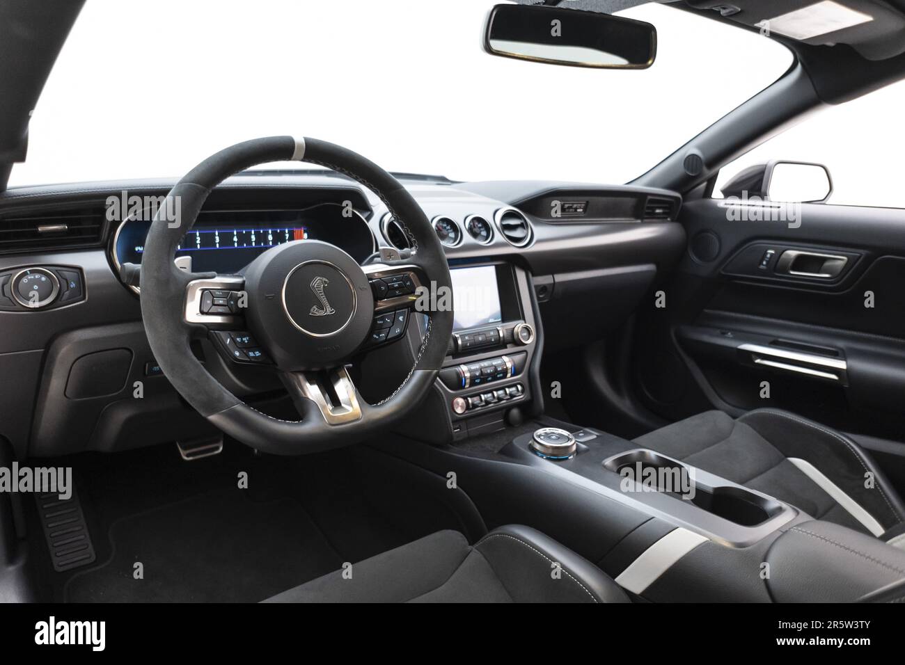 The interior of a car, showcasing the black front dash and driver seat ...