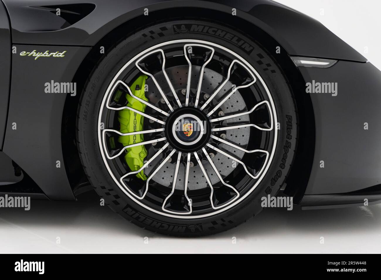 A porsche car wheel on a white background with its rim and spokes ...