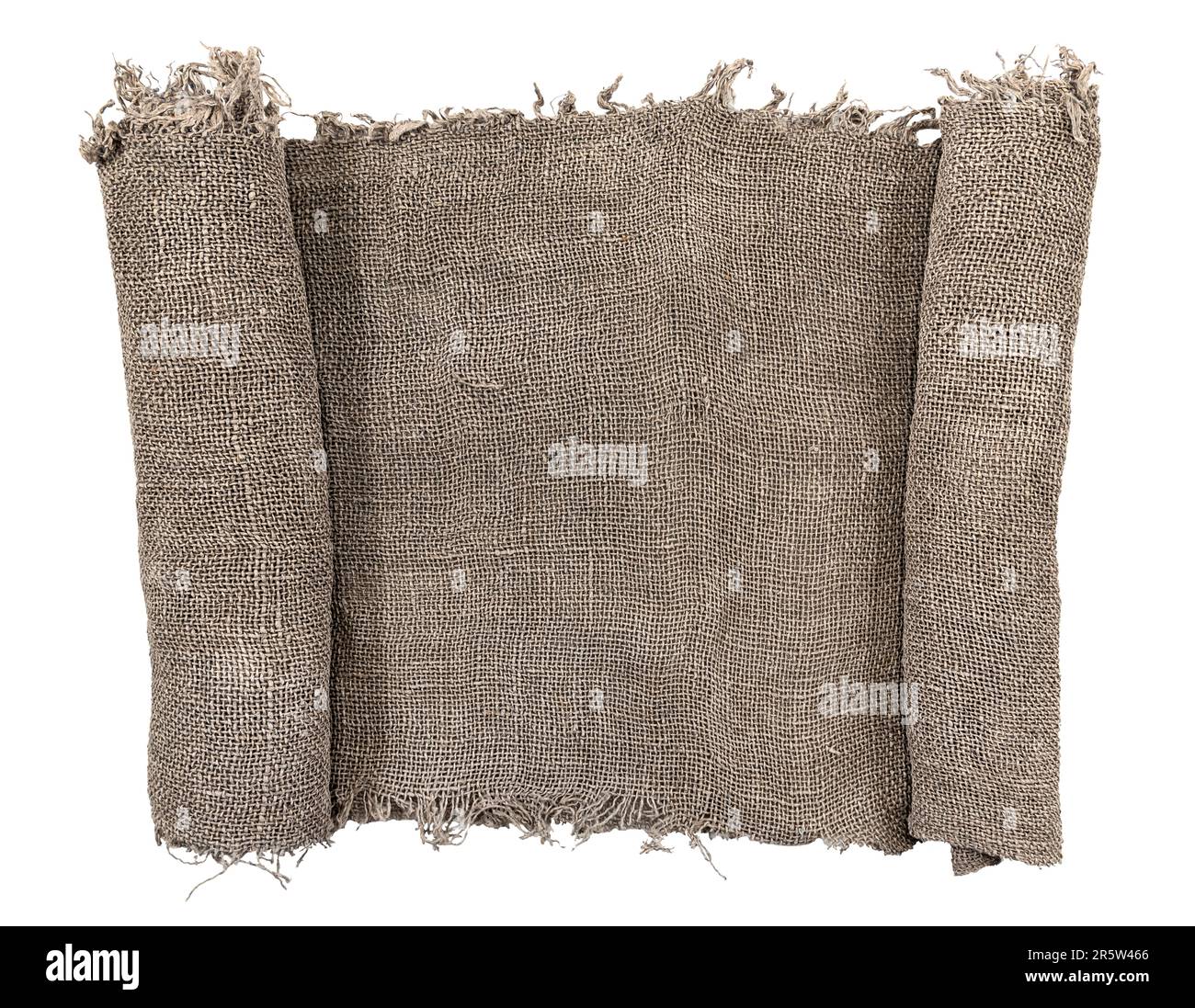 Burlap texture. A piece of torn burlap on a white background. Canvas ...