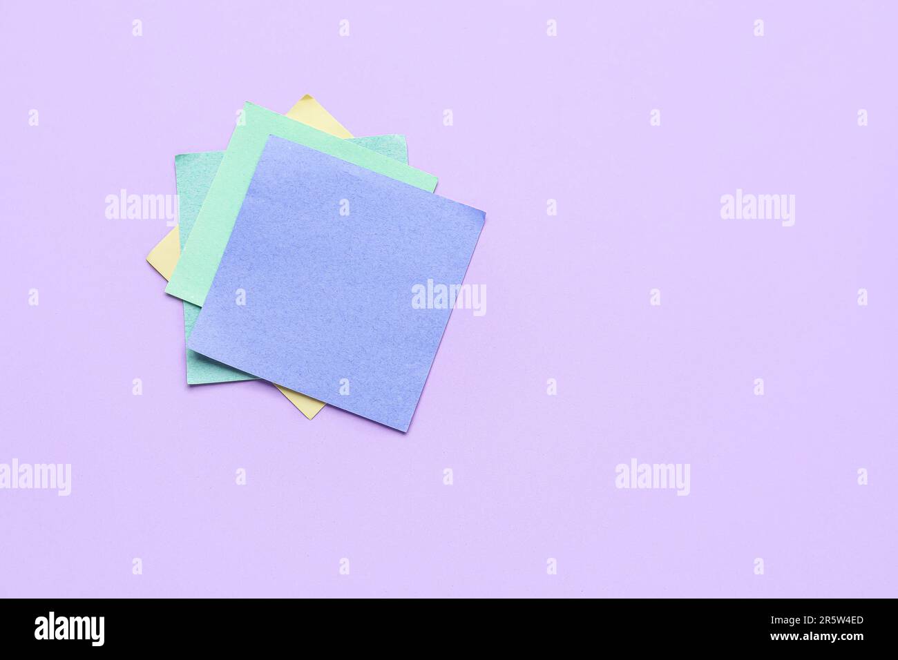 Sticky notes on violet background. Update concept Stock Photo - Alamy